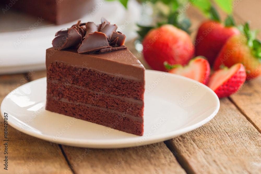 Triangle slices of delicious dark chocolate fudge cake topping with ...