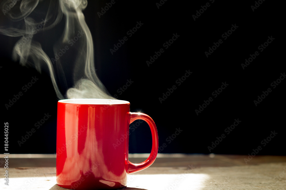 Steaming coffee cup on dark background Stock Photo | Adobe Stock