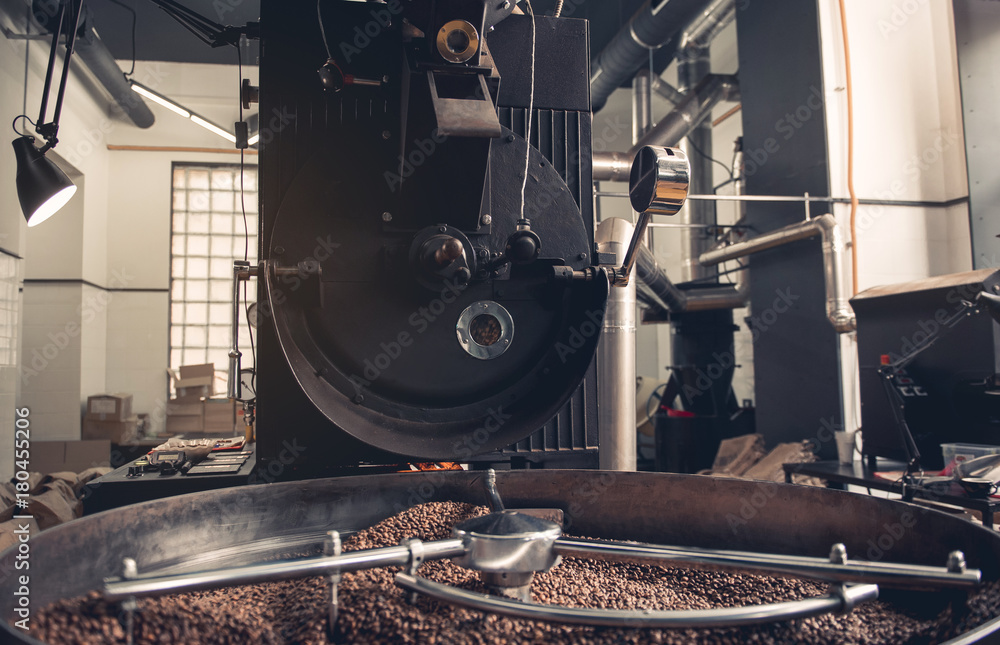 Big modern coffee roaster machine with grain chiller creating ...