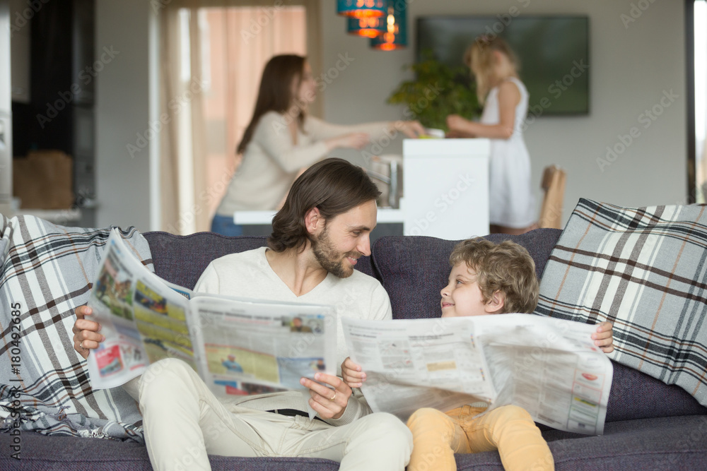Child Reading Newspaper