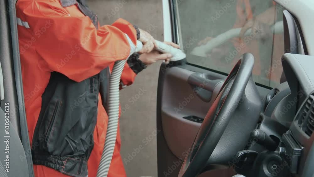 Worker cleans the cabin of car with vacuum cleaner Stock Video | Adobe ...