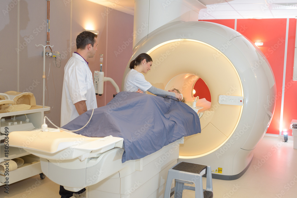happy patient undergoing mri scan at hospital Stock Photo | Adobe Stock