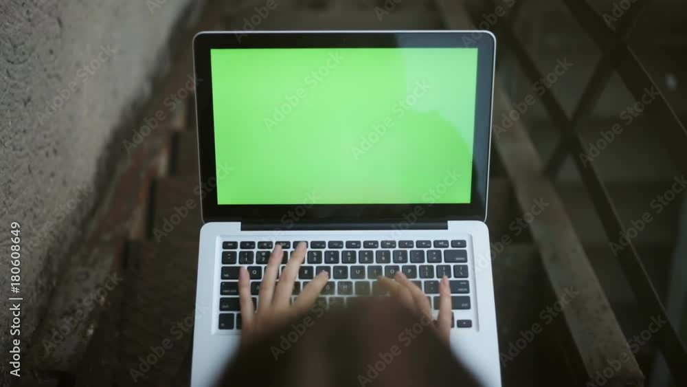 Closeup female Hands Typing keyboard Laptop notebook green screen ...