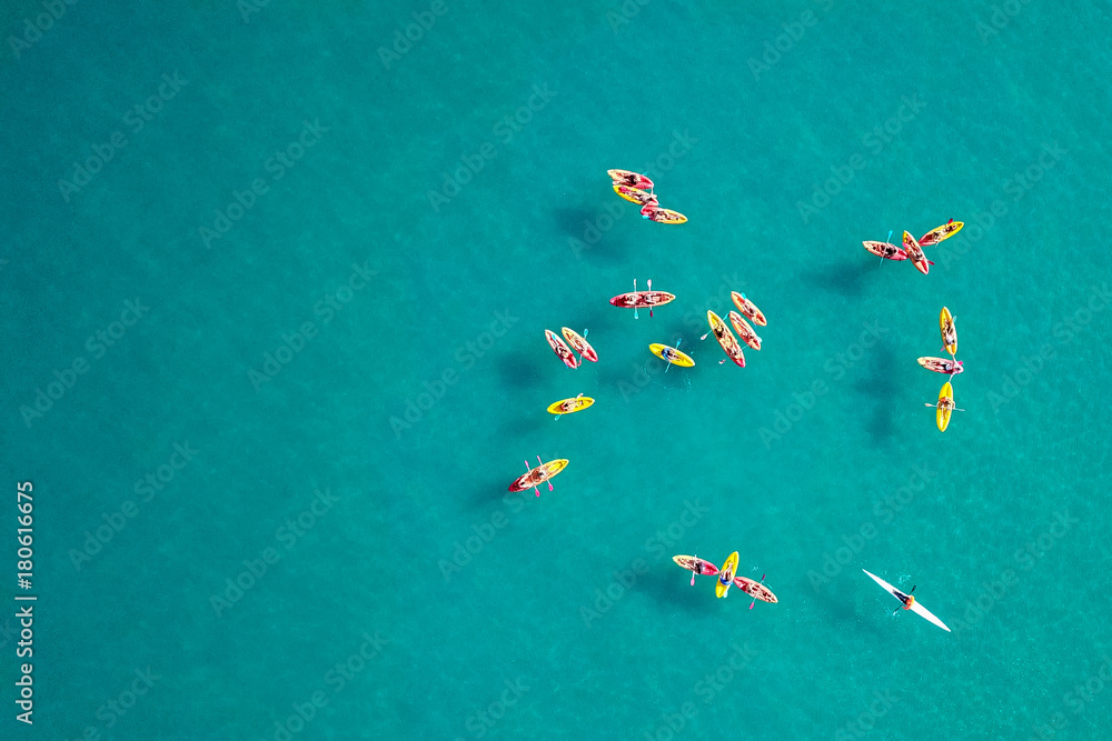 Large group of yellow Kayaks at calm water - Top down aerial view Stock ...