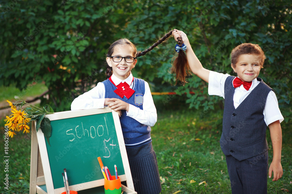 boy pulling girl's hair, flirting Stock Photo | Adobe Stock