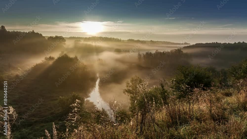 Beautiful sunrise over valley with stunning mist in autumn, timelapse ...