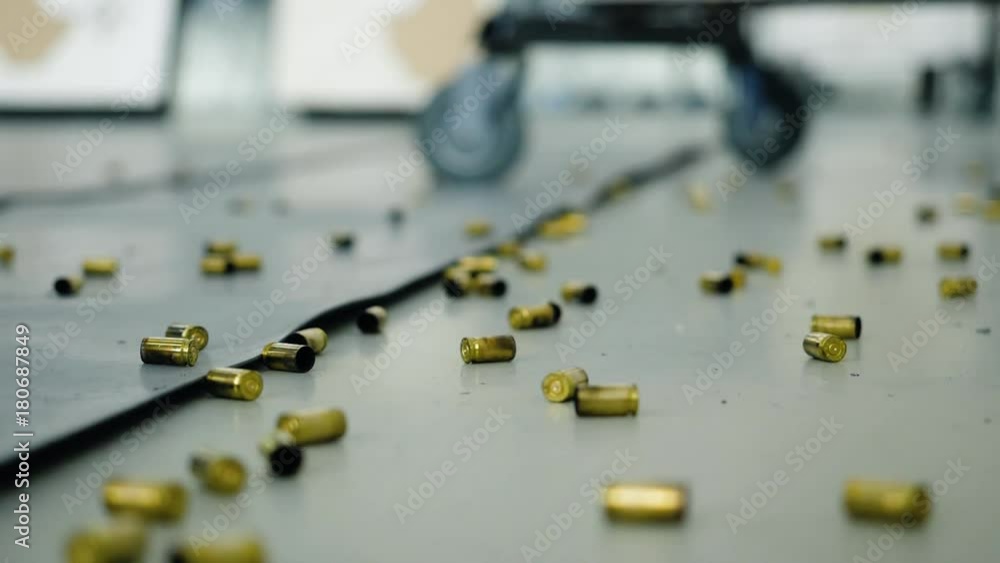 Huge number of shell casings from bullets lying on the floor in the ...