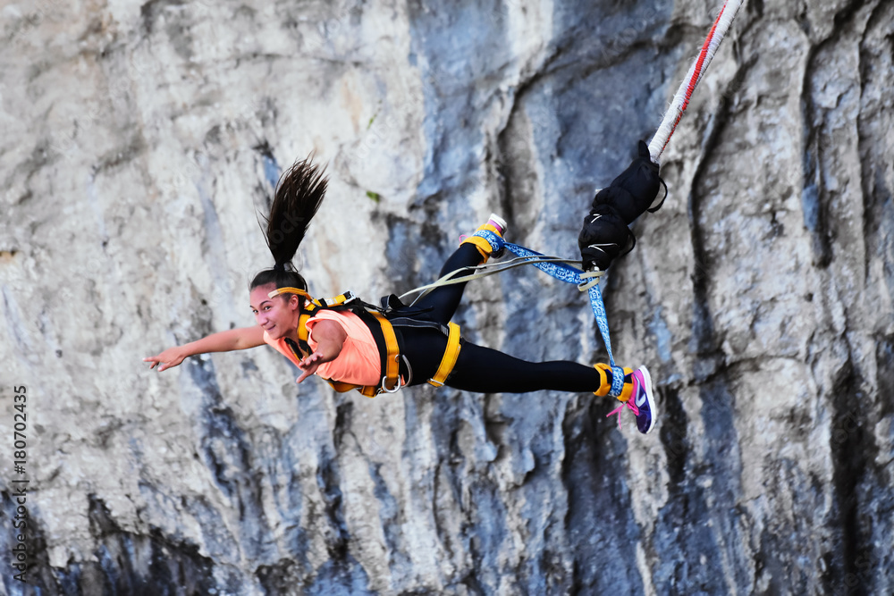 Bungee jumps, extreme and fun sport. Bungee in a cave. Stock Photo ...