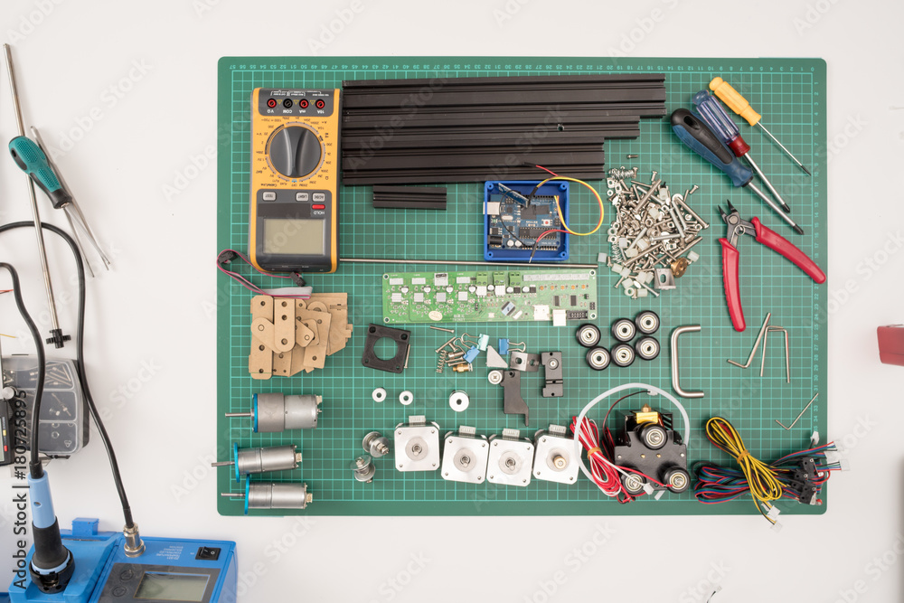 manual assembly of electronic mechanical device from a set of spare ...