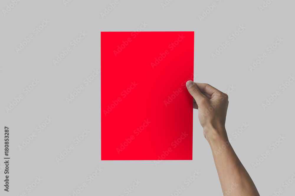 Right hand holding A4 paper in the right hand. Leaflet presentation ...