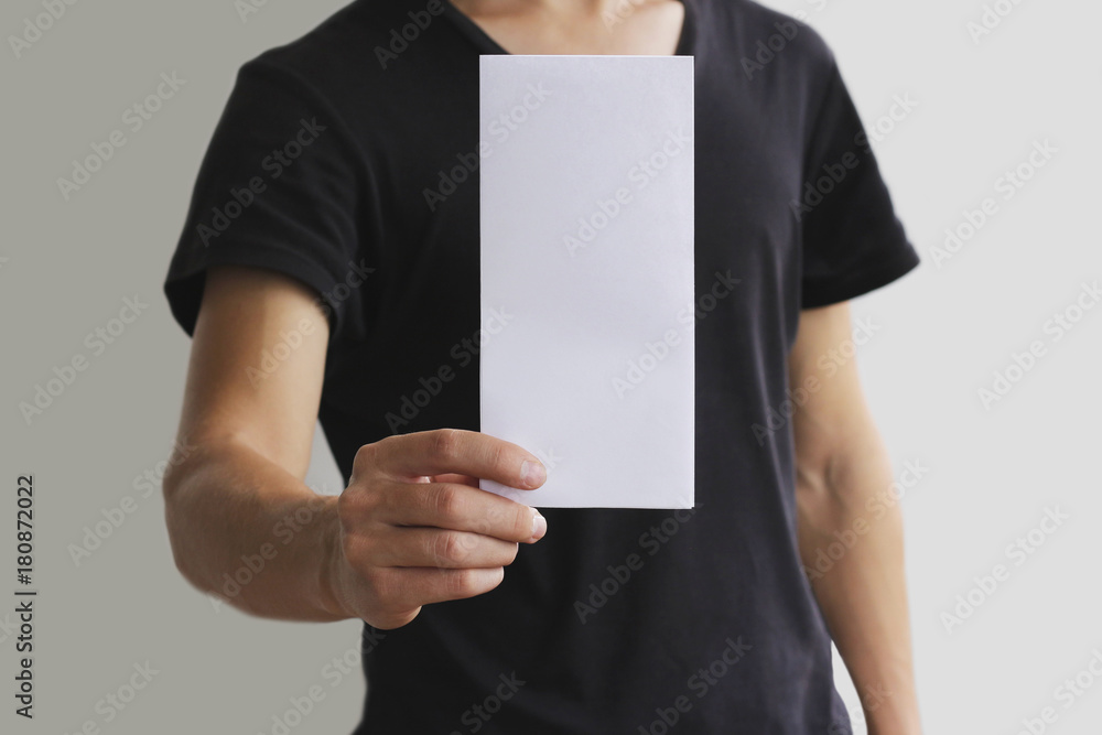 Man showing blank white flyer brochure booklet. Leaflet presentation ...