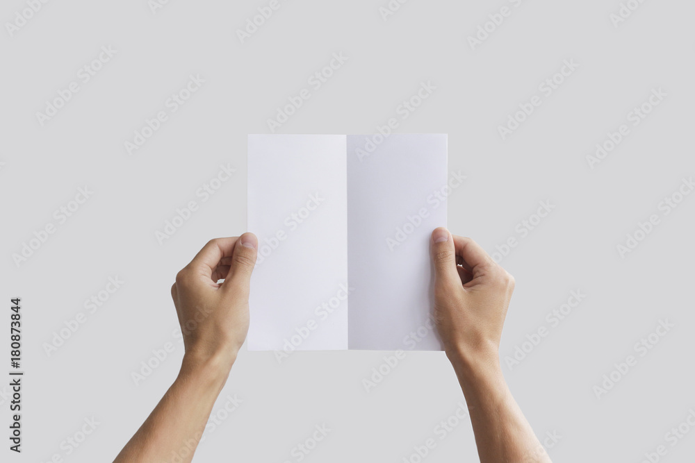 Hand holding blank brochure booklet in the hand. Leaflet presentation ...