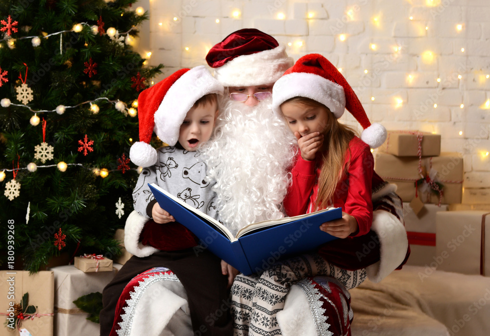 Santa Reading A Book To Children