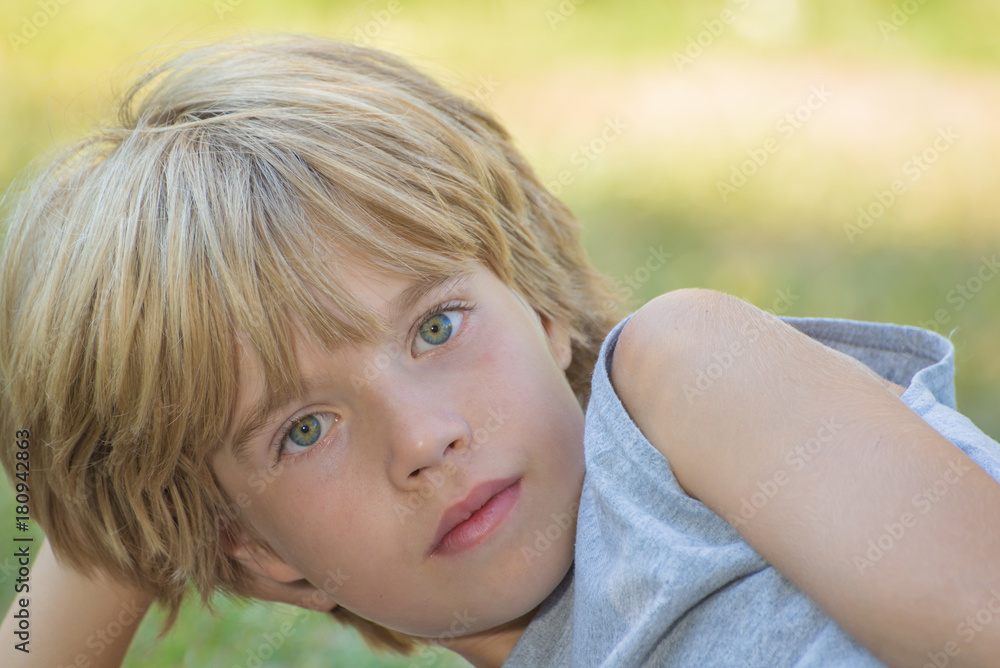 Portrait of a boy,laying resting his head on his hand Stock Photo ...