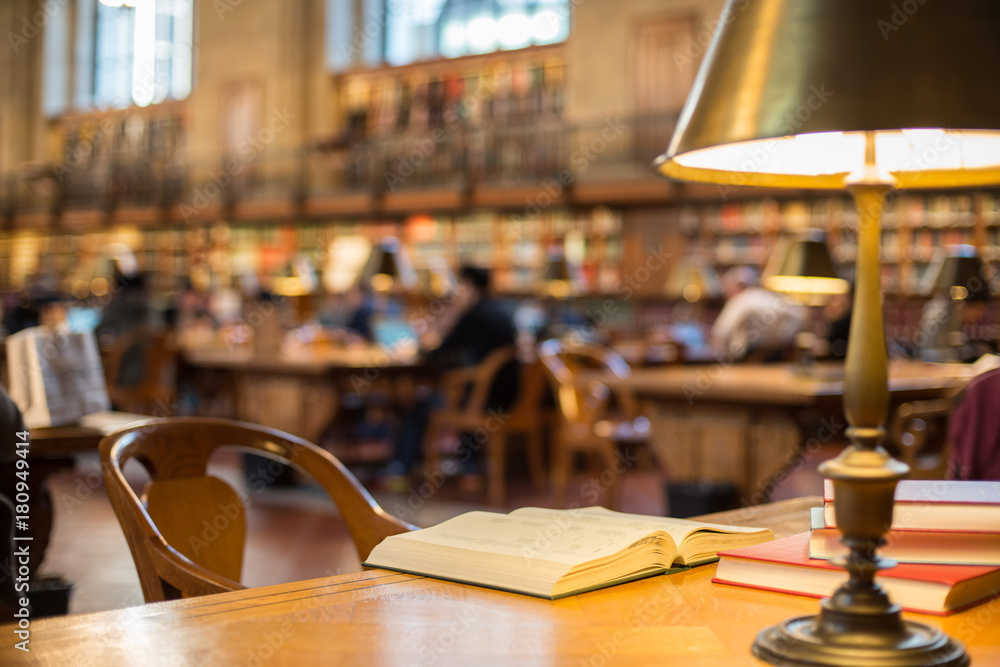 Book on wooden table in reading room in library Stock Photo | Adobe Stock