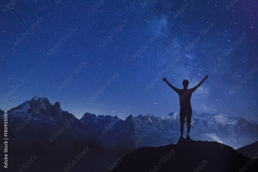 person looking at night starry sky , silhouette of man standing with ...