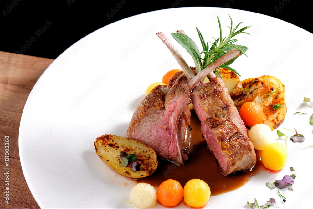 Fine dining, roasted Lamb chops with potato, rosemary and vegetable ...