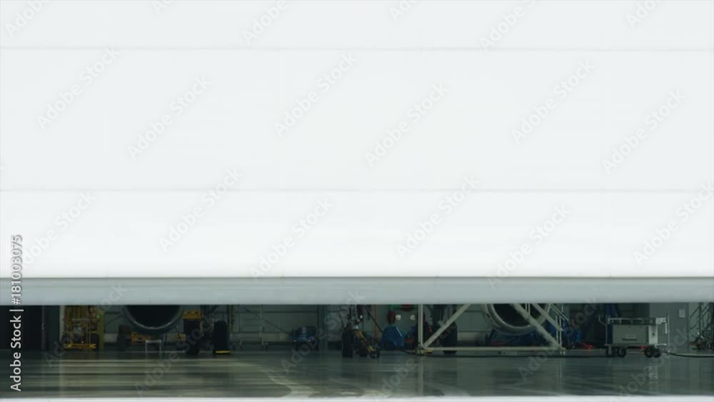 Gates open aircraft hangar is located inside a passenger plane. Gate of ...