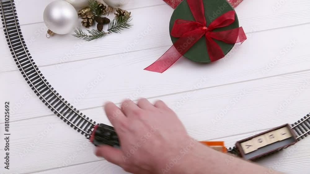 Man's hand puts the toy train on the flights Stock Video | Adobe Stock
