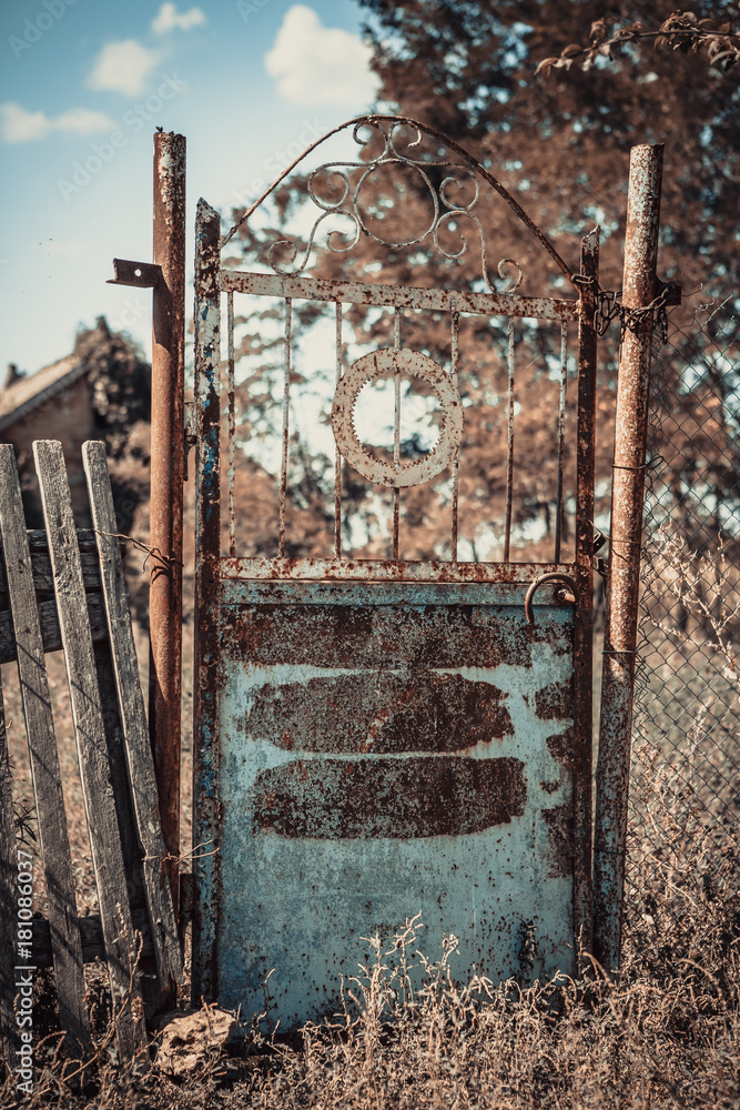 old rickety gates. Old rusty gate in an abandoned house. Broken gate ...