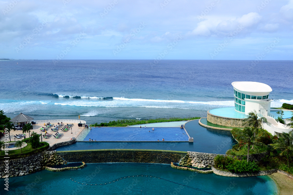 Beautiful swimming pool align the sea level with seaview of resort ...