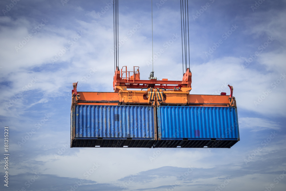 Twin lift spreader performing double lift container from ship and load ...