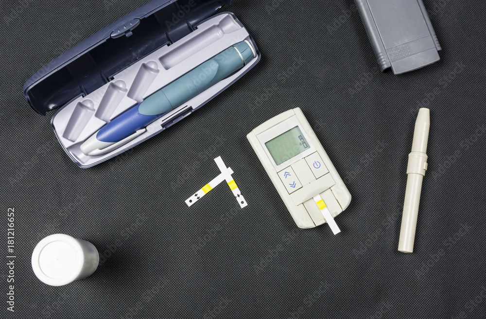 Glucose meter and Insulin pen. Stock Photo | Adobe Stock