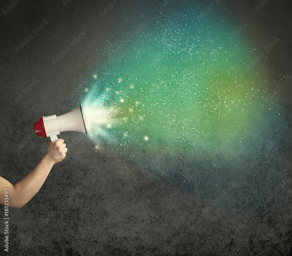Hand holding megaphone Stock Photo | Adobe Stock