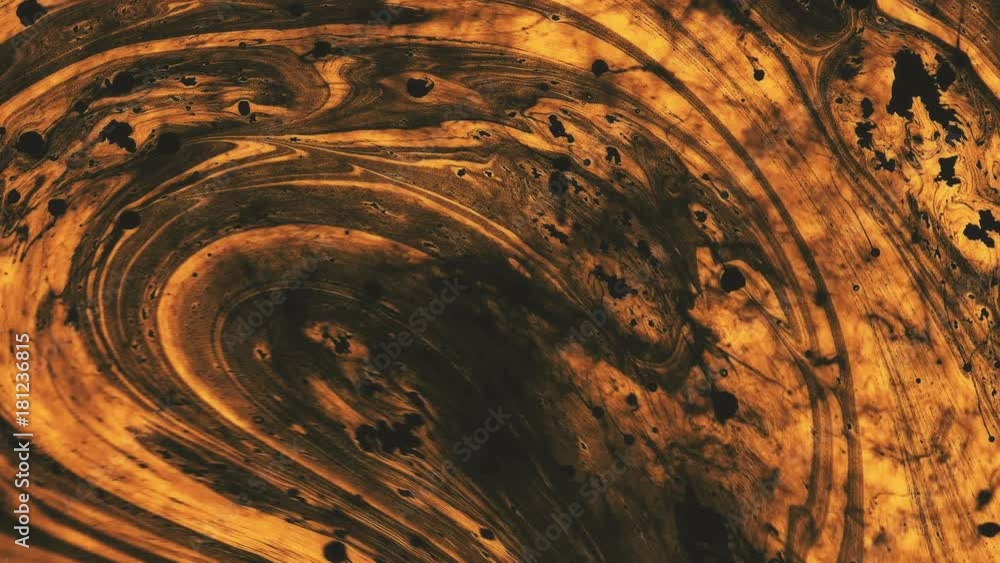 patterns in the movement of dirty yellow butter smeared with a black ...