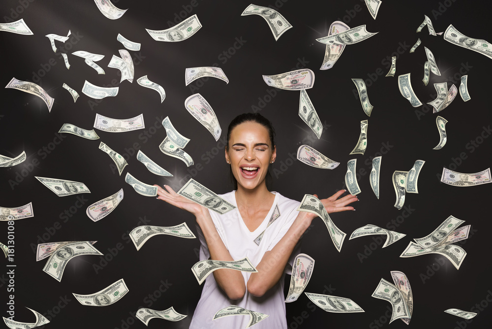 girl with a lot of money around her falling trom above and big spender ...