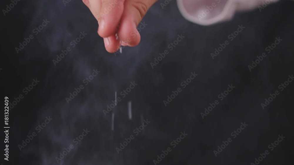 Close up of chef's hand salting food Stock Video | Adobe Stock