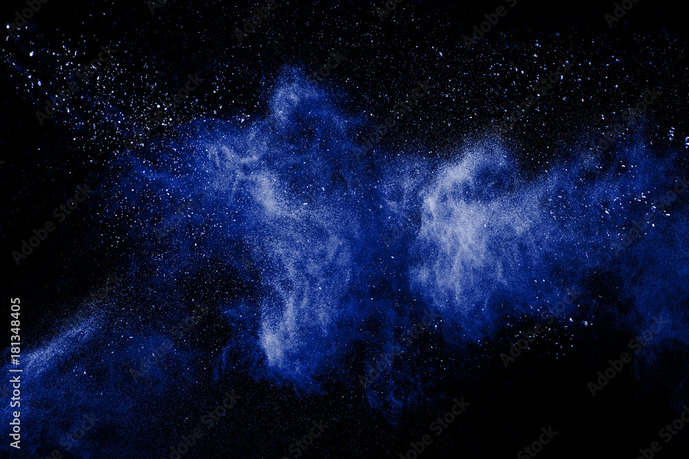 Abstract blue dust explosion on black background. Abstract blue powder ...