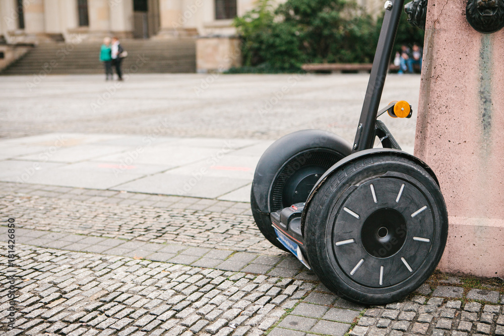 Gyroscope is parked to the wall in the square in Berlin. Modern ...