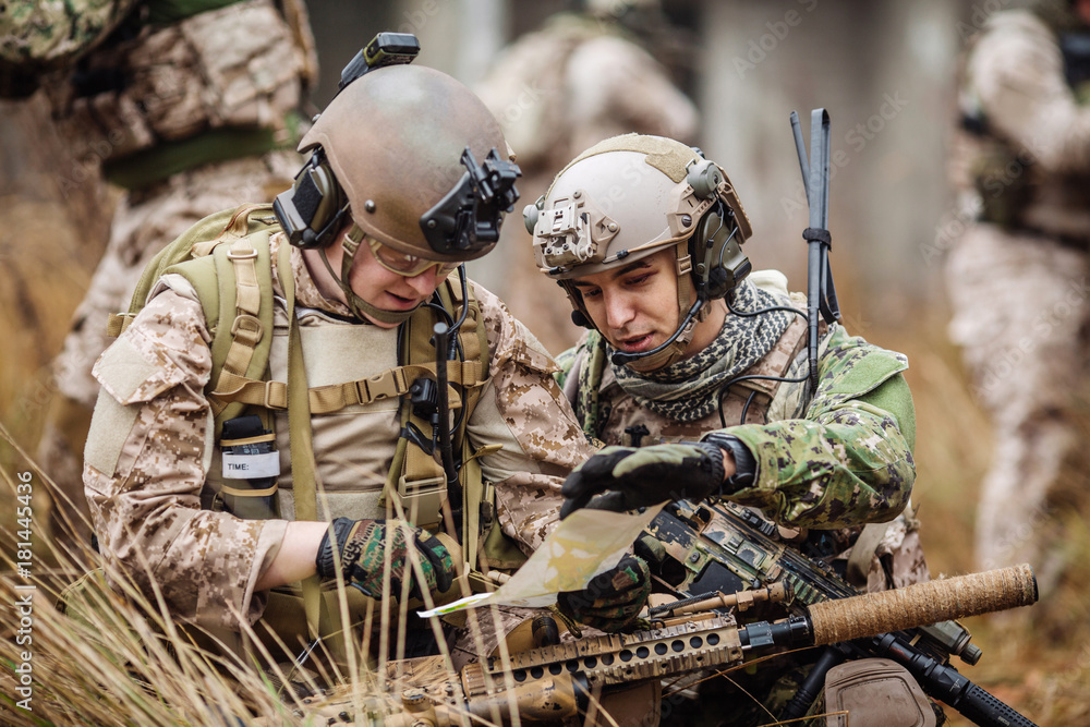 special forces soldiers with weapon take part in military maneuver. war ...