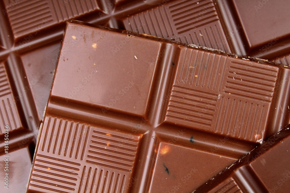 Chocolate bars as background. Milk and dark shiny chocolate texture ...