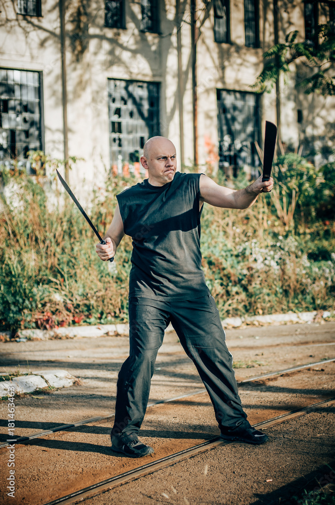 Two machete fighting concept. Long knife weapon training Stock Photo ...