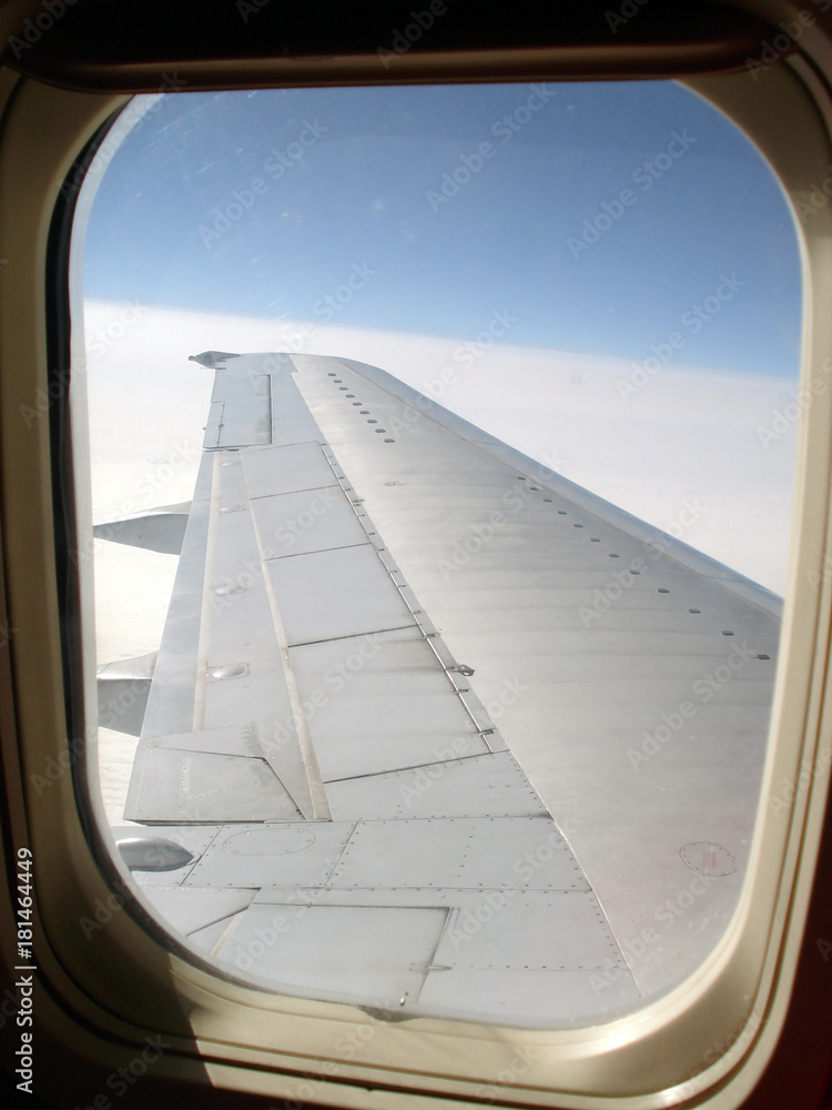 The wing of the aircraft out of the window. Wing view from the window ...