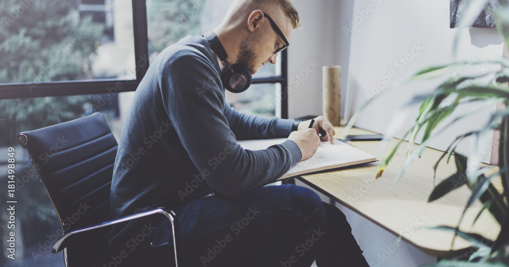 Skilled designer caucasian man drawing abstract sketch with pen.Art ...