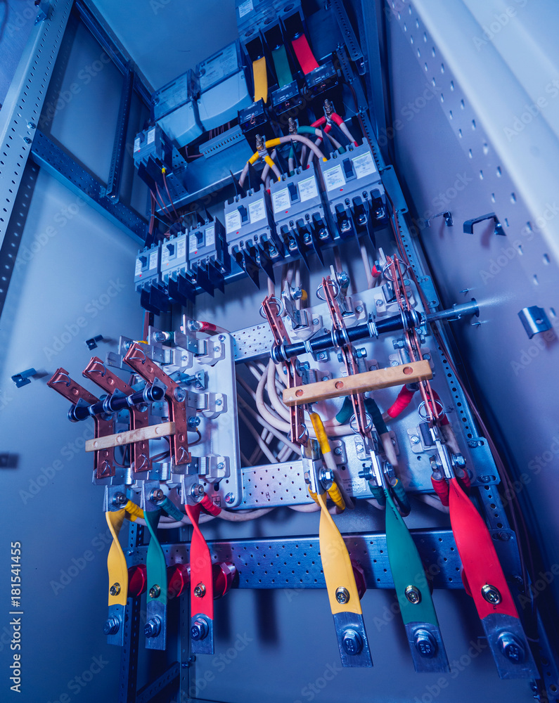 Wires and switches in electric box. Electrical panel with fuses and ...