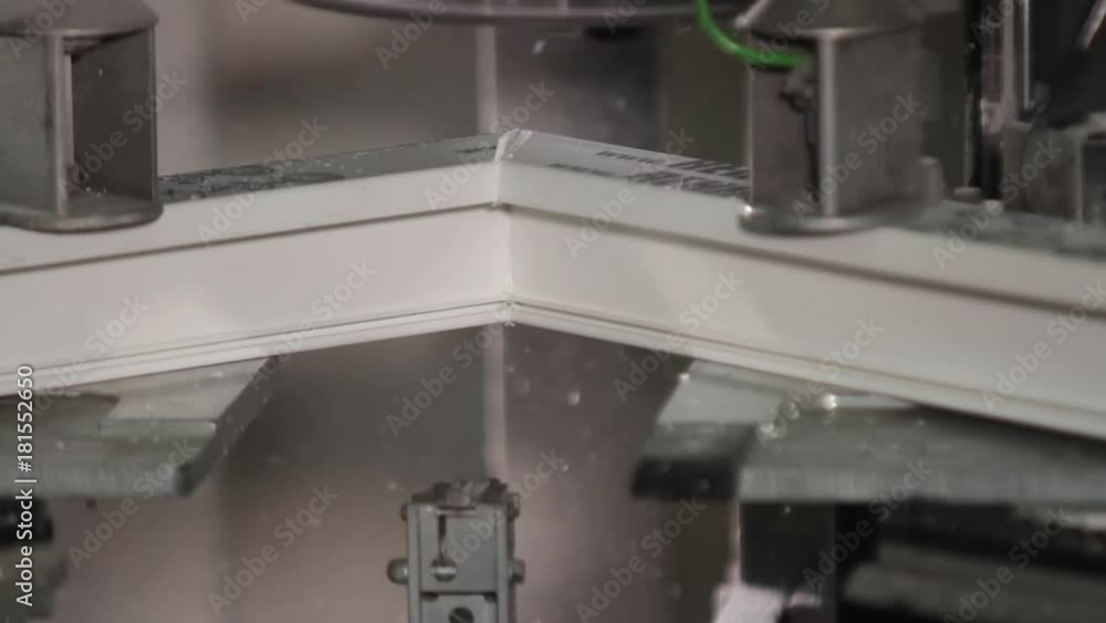 Cleaning of welds on plastic window. Machine for trimming welded seams ...