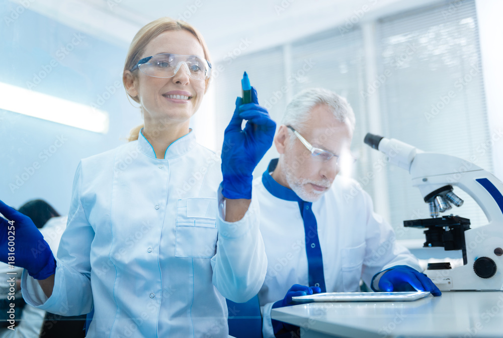 Biologists uniform. Good-looking alert smiling budding woman scientist ...