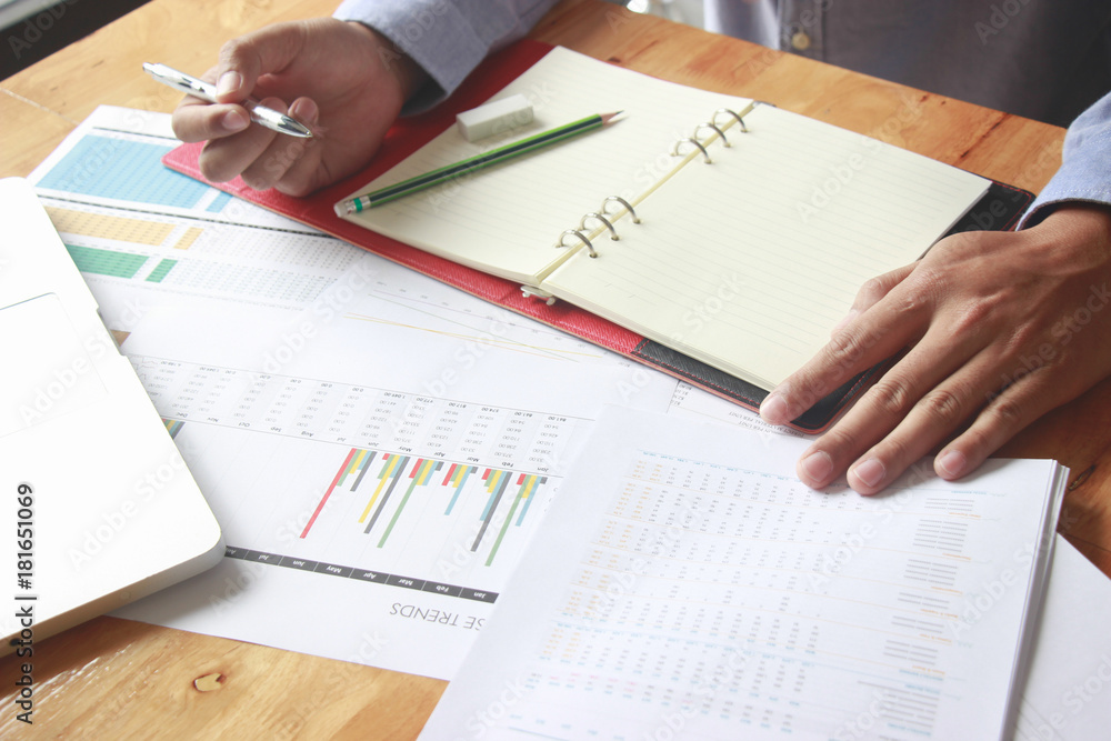 Man Writing with document at work office Stock Photo | Adobe Stock