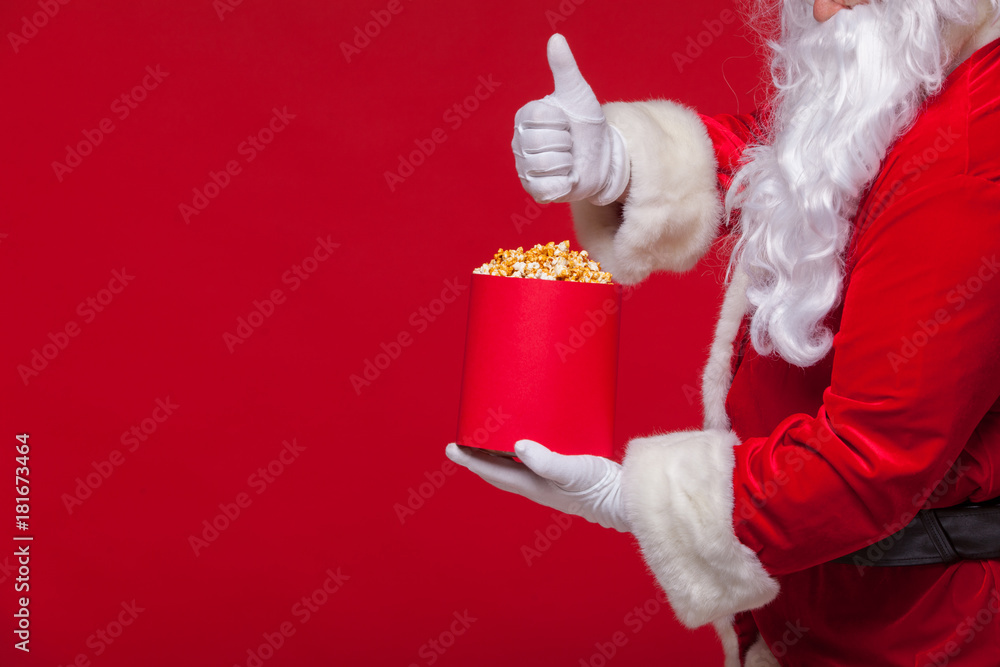 Christmas. Photo of Santa Claus gloved hand With a red bucket with ...