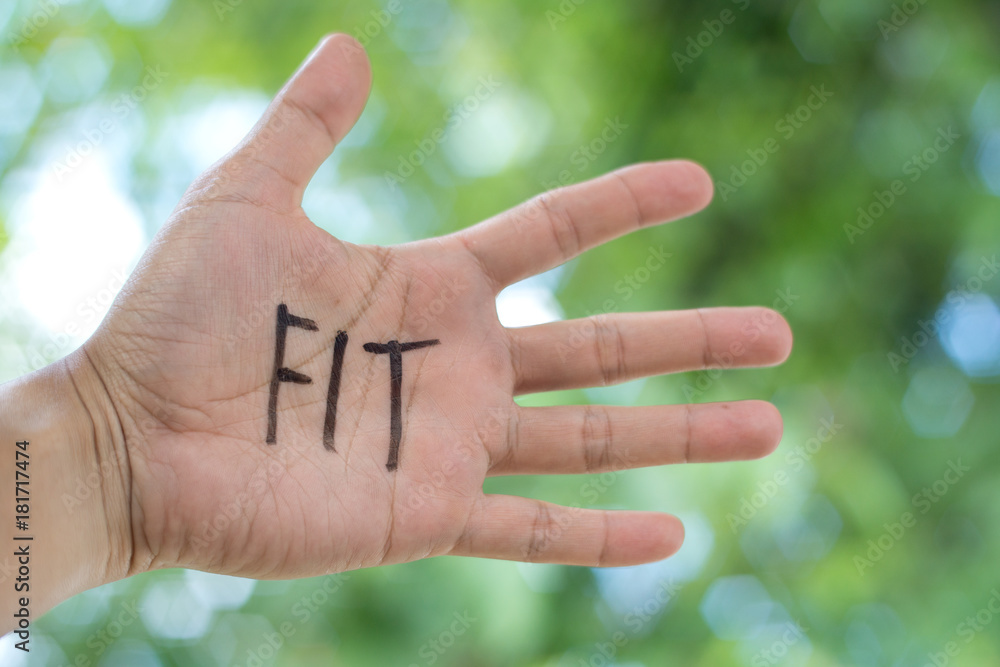 Concept Photo Of A Handwriting Word "FIT" On The Left Hand With Blurry ...