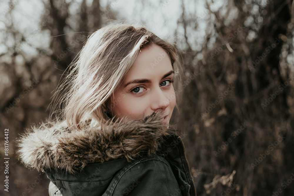 Beautiful young woman with blonde hair, wide eyebrows and blue eyes ...