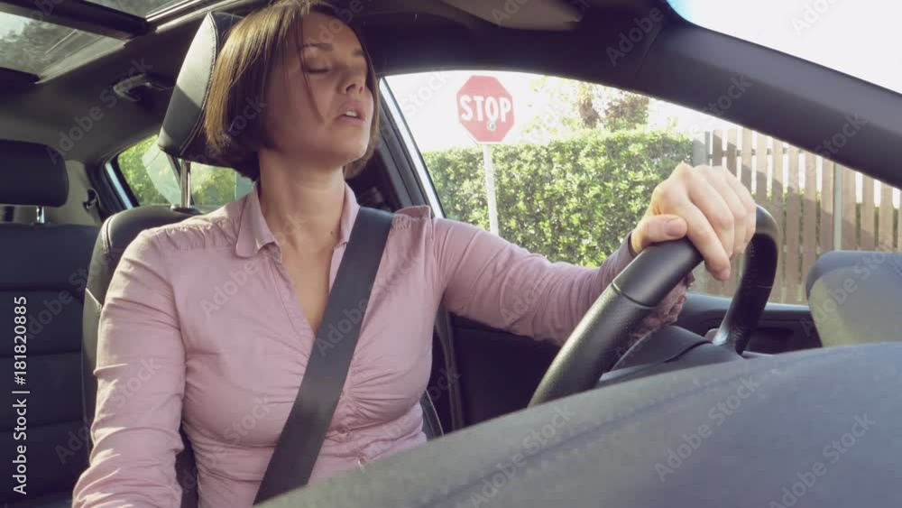 Beautiful woman driving back with car slow motion retro style Stock ...