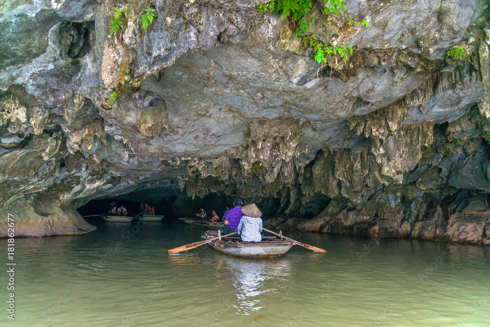 Bamboo tourist boat in tam coc caves at Natural Reserve of Van Long ...