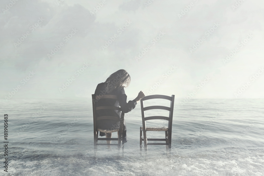 sad woman looks nostalgically at her lover's empty chair Stock Photo ...