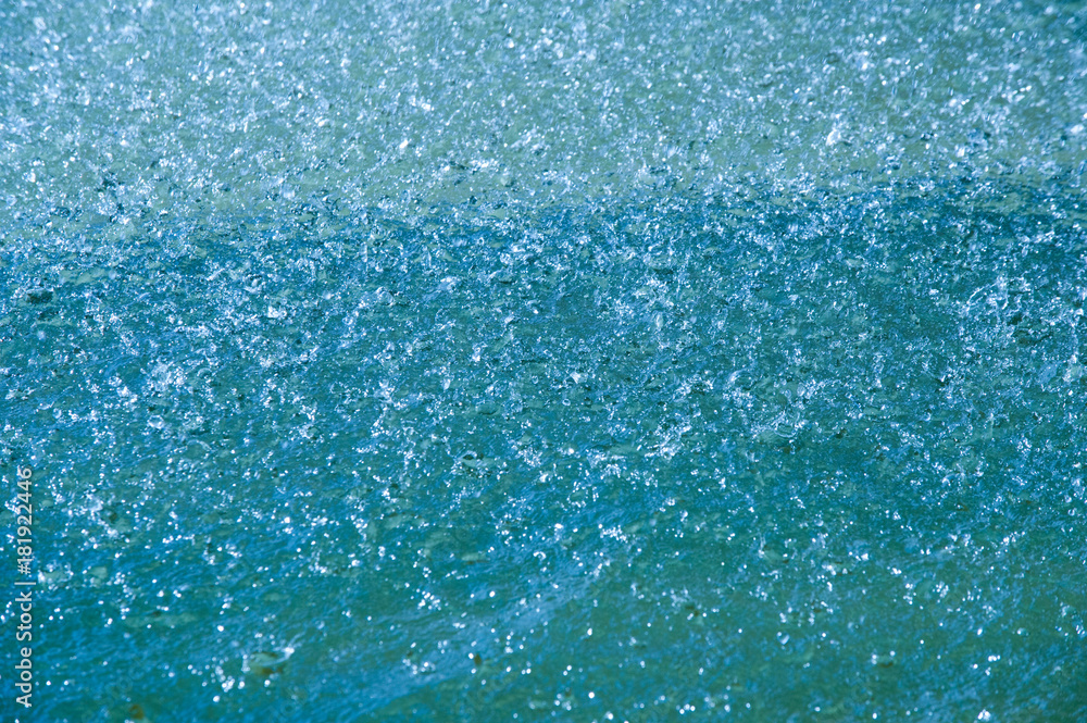 Texture, background, pattern. Water in the pools, spray from the ...