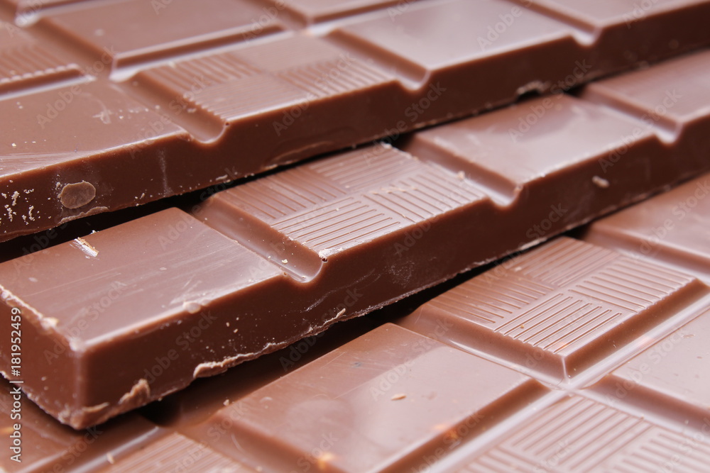 Chocolate bars as background. Milk and dark shiny chocolate texture ...